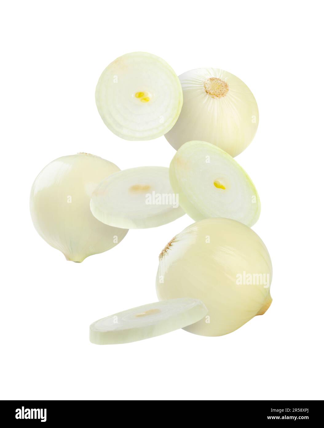 Whole and cut onion bulbs falling on white background Stock Photo - Alamy