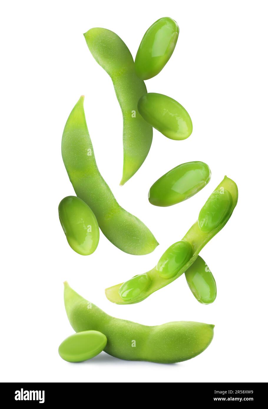 Delicious cooked soy beans and pods falling on white background ...