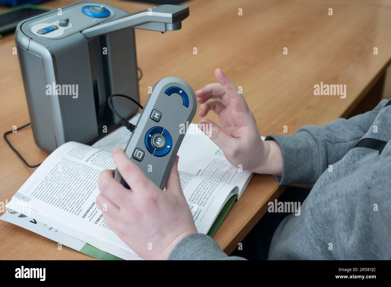 A visually impaired man uses a scanning and reading machine Stock Photo ...