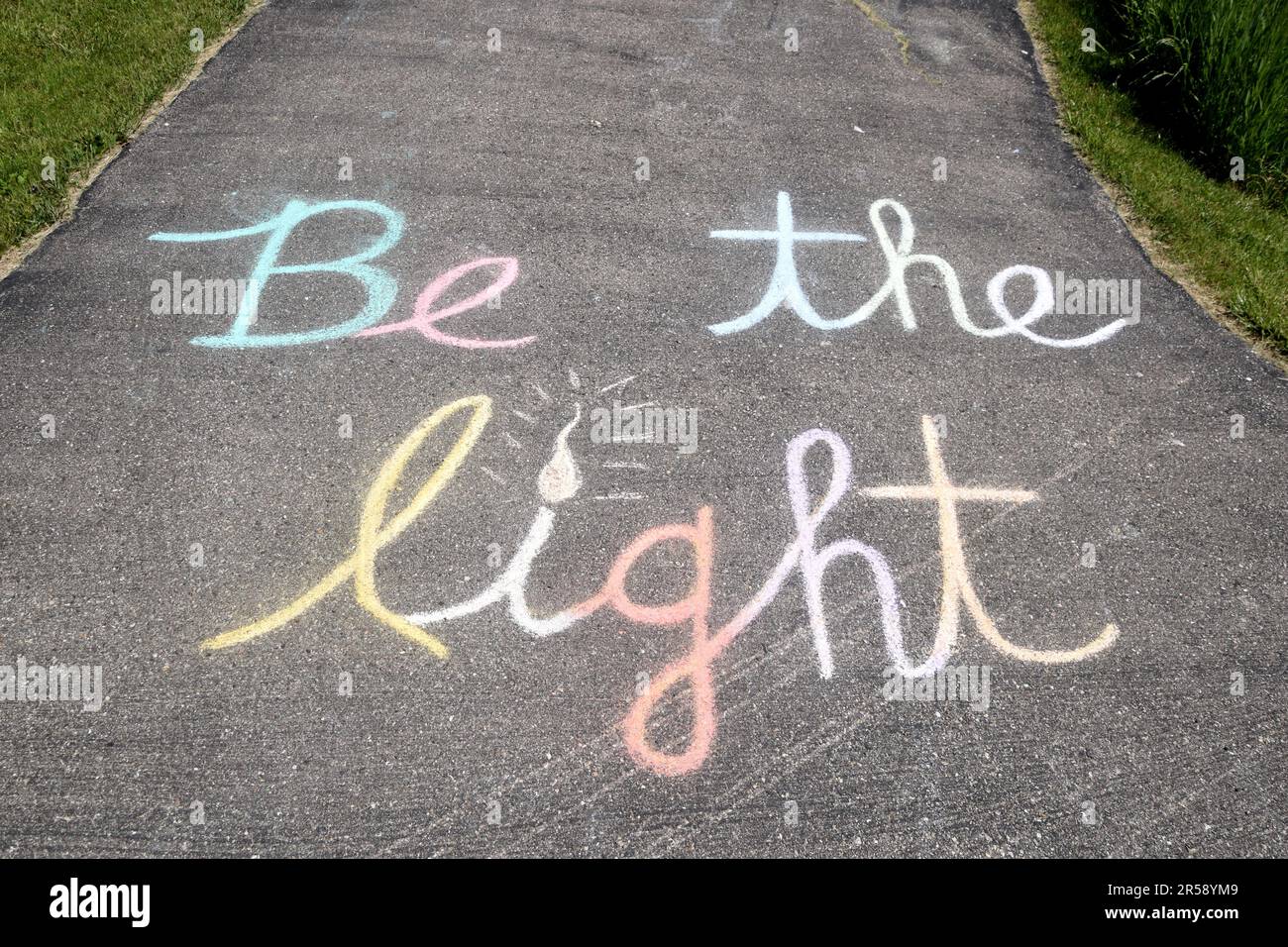 Uplifting chalk art message "Be The Light Stock Photo - Alamy
