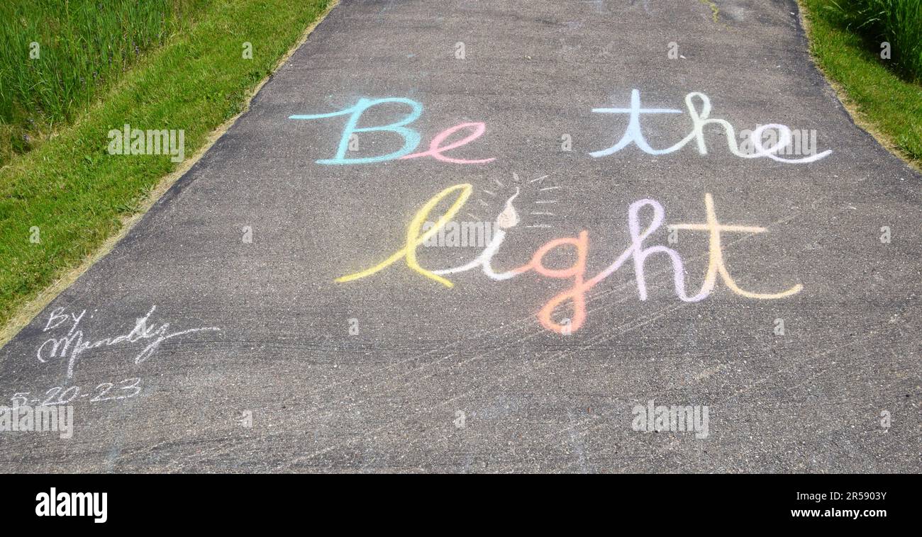 Uplifting chalk art message "Be The Light Stock Photo - Alamy