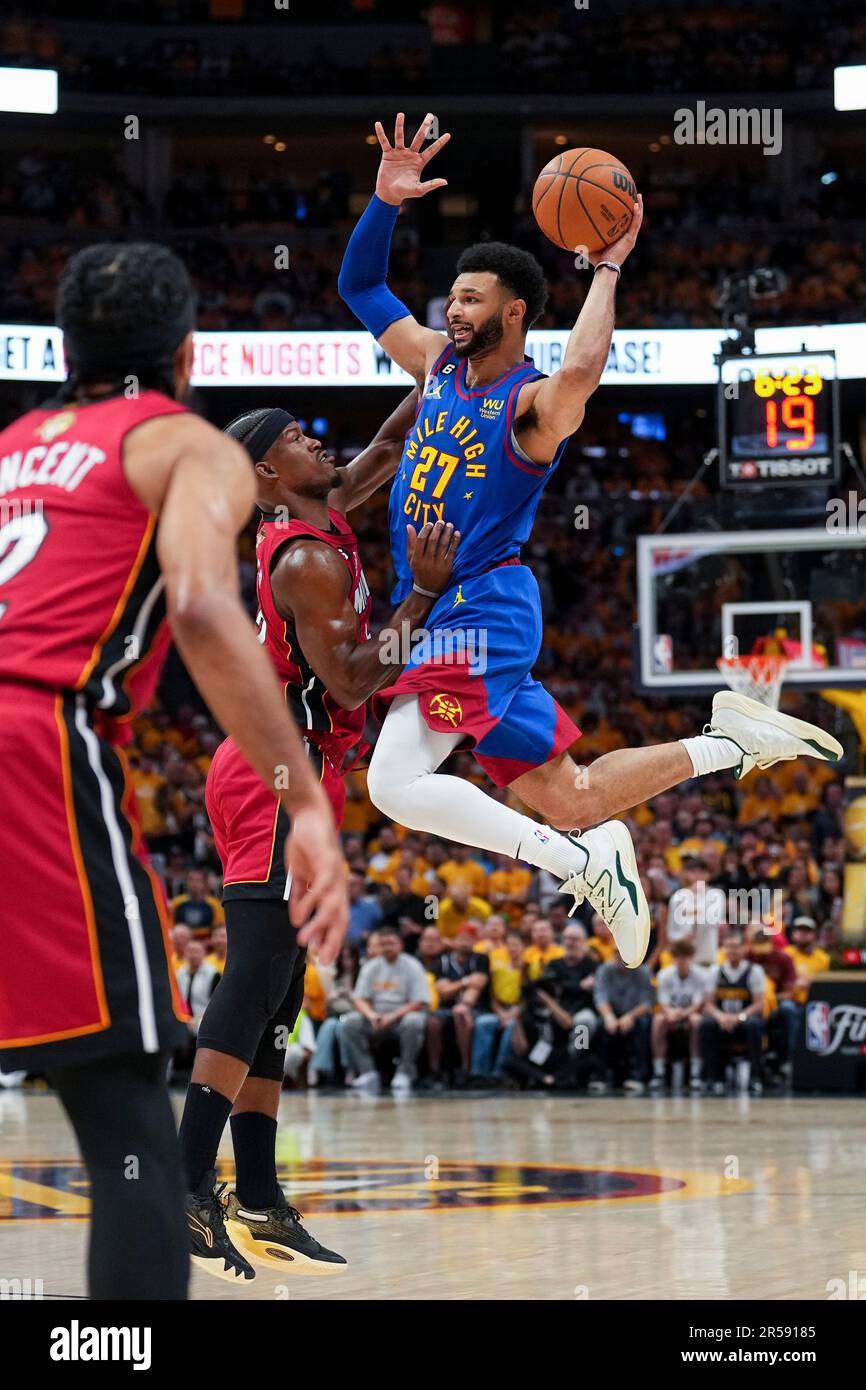 Denver Nuggets guard Jamal Murray (27) looks to pass while defended by ...