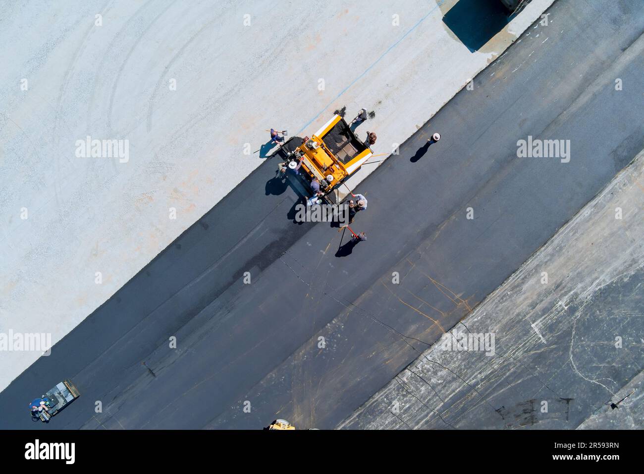 Roadwork team is ensuring that parking lot is properly prepared before ...