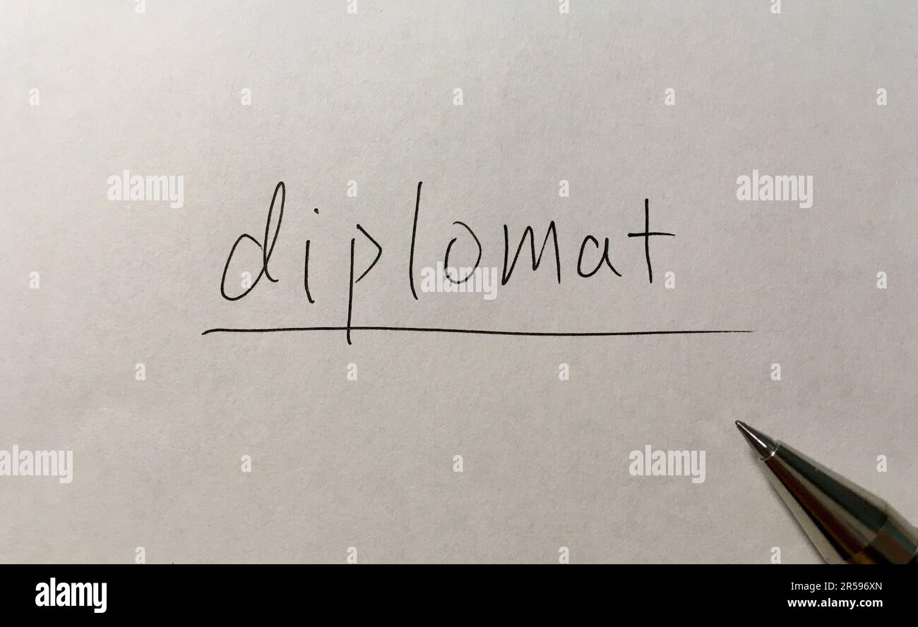 Diplomat concept word on paper background Stock Photo - Alamy