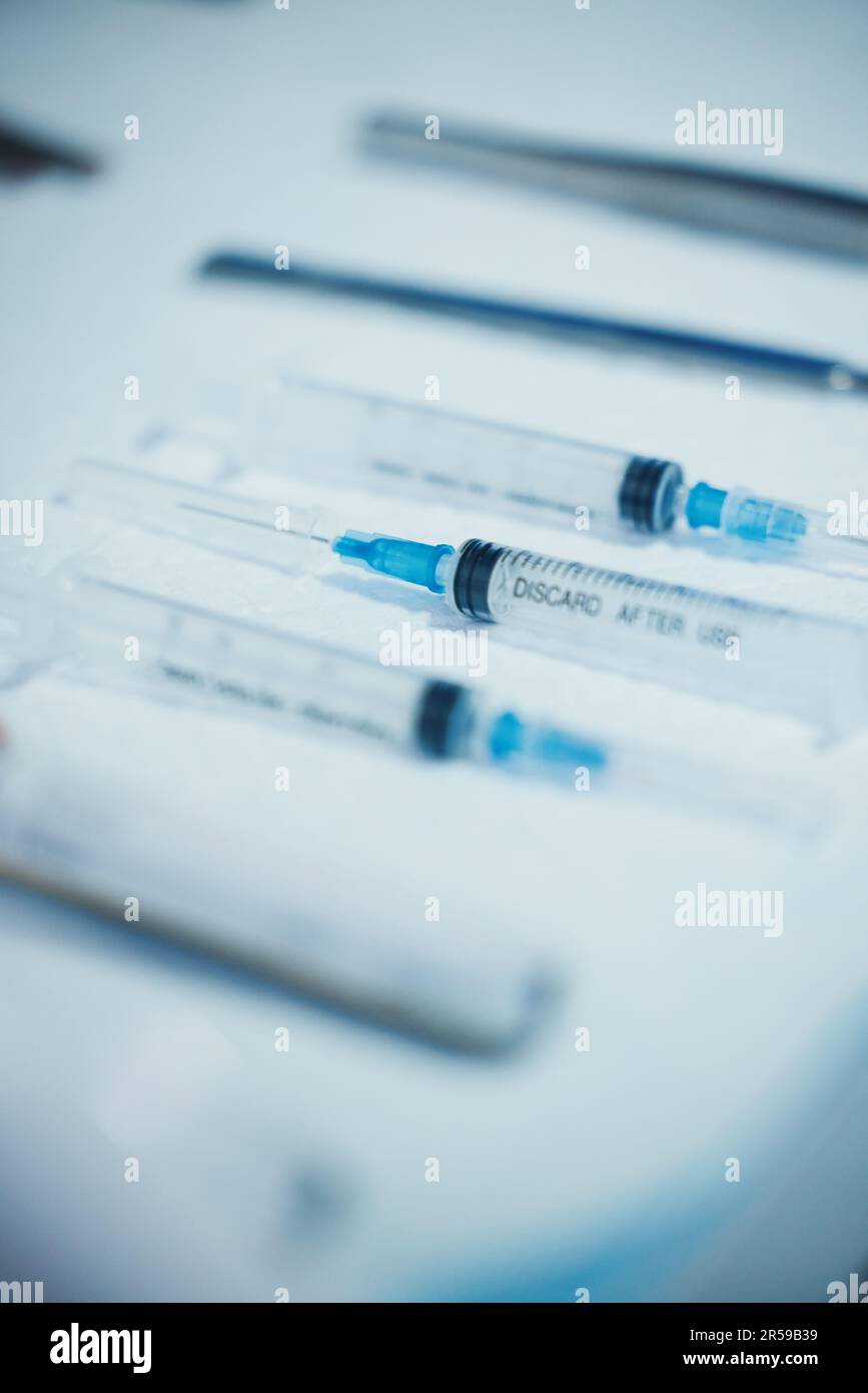 Medical tools closeup, needle syringe for surgical procedure and ...