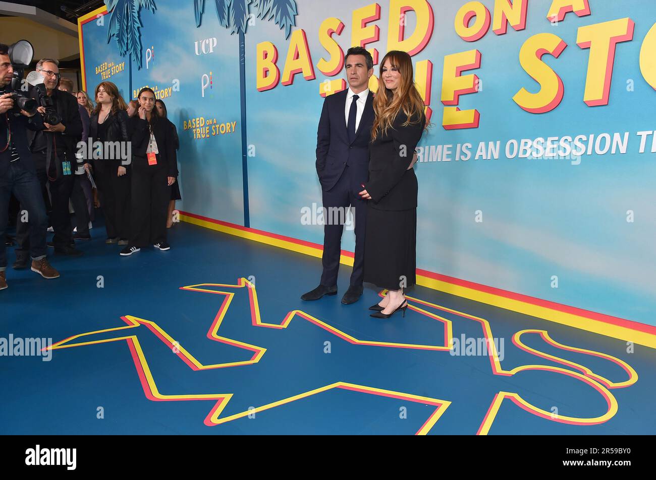 Chris Messina, left, and Kaley Cuoco arrive at the Los Angeles premiere ...