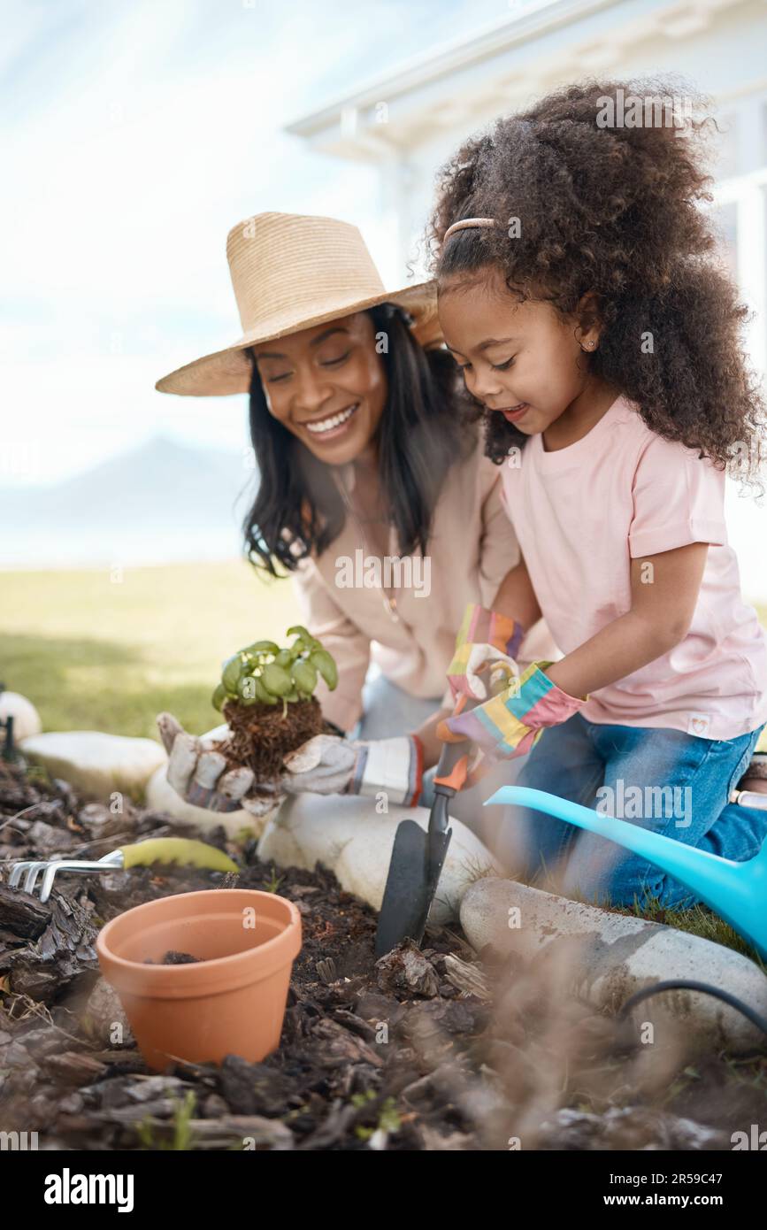 Gardening, mother and child with plant in soil for learning ...
