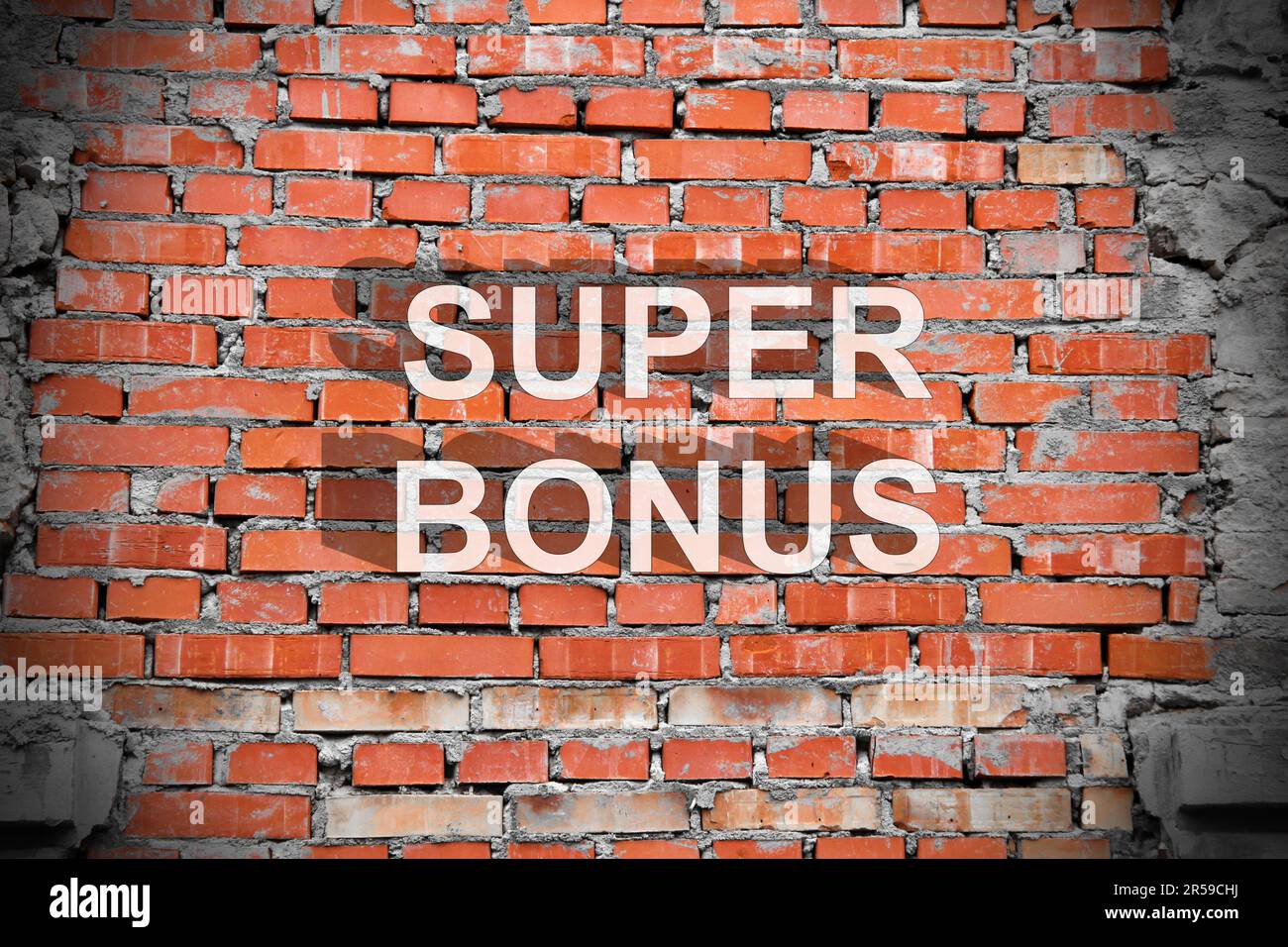 Text "Super Bonus" with bricks as background Stock Photo - Alamy