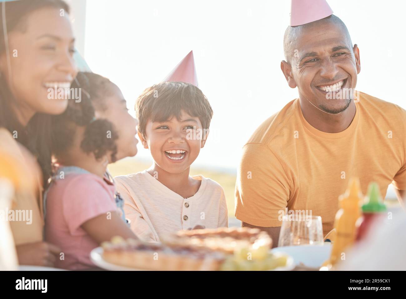 Birthday, park and happy parents with children in park for event ...