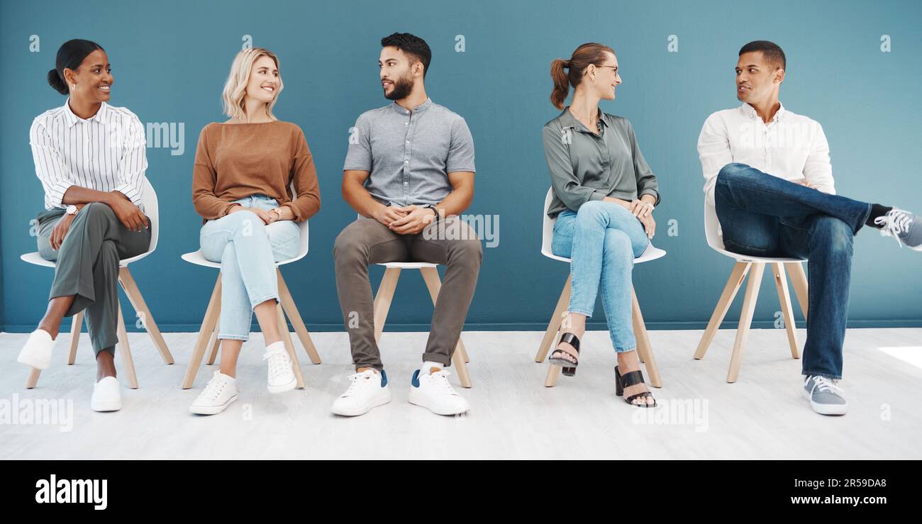Interview queue, business people and talk by wall with smile, diversity ...