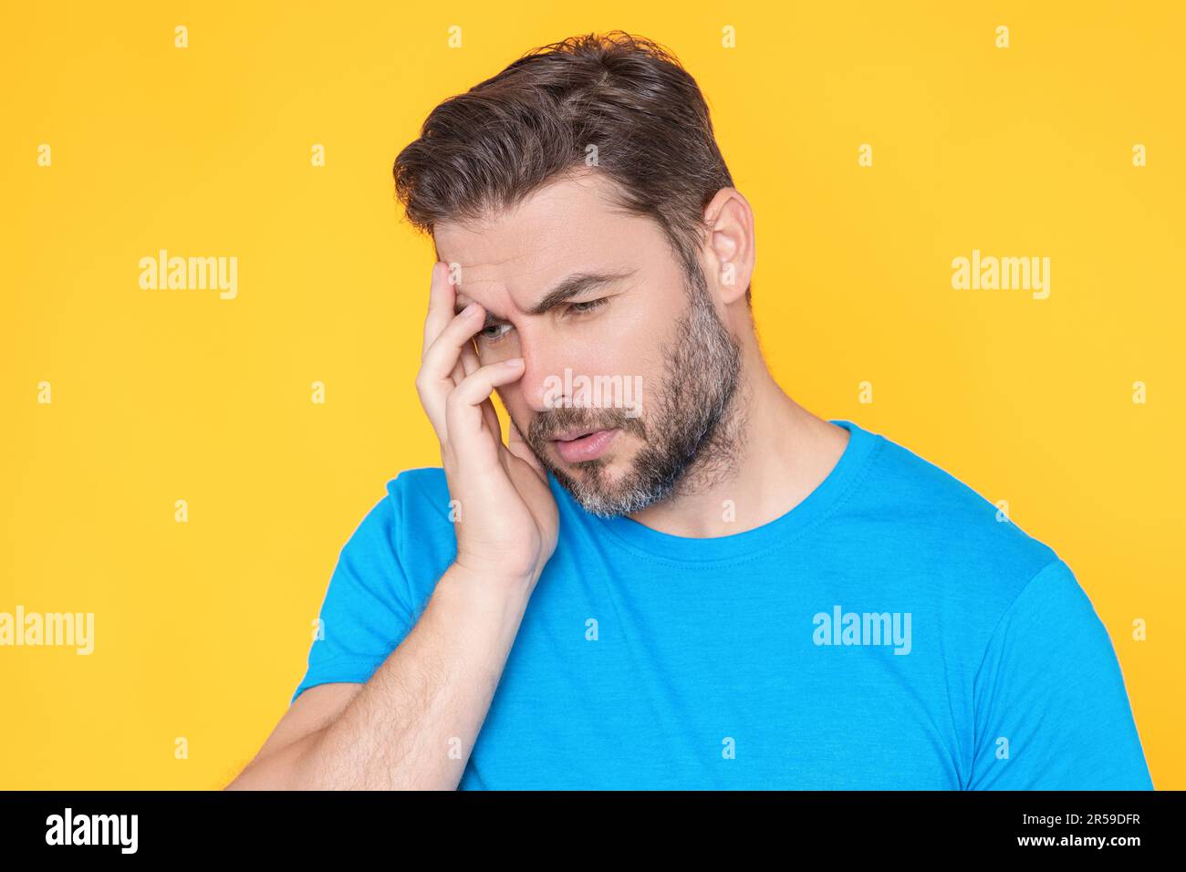 Man suffering from headache. Tired, headache and eye strain. Man with ...