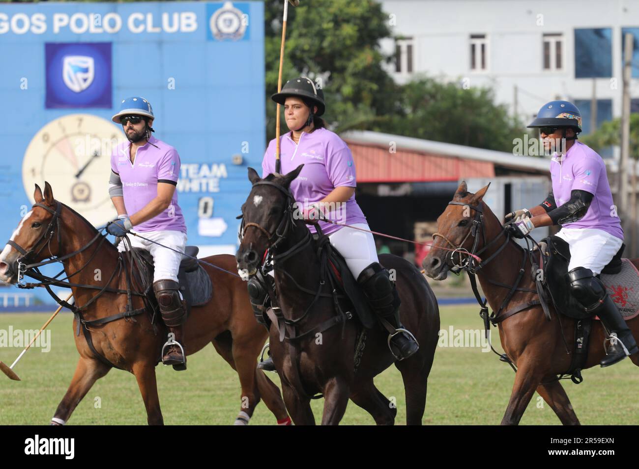 Polo players compete for the ball during the Ladies Polo invitation ...