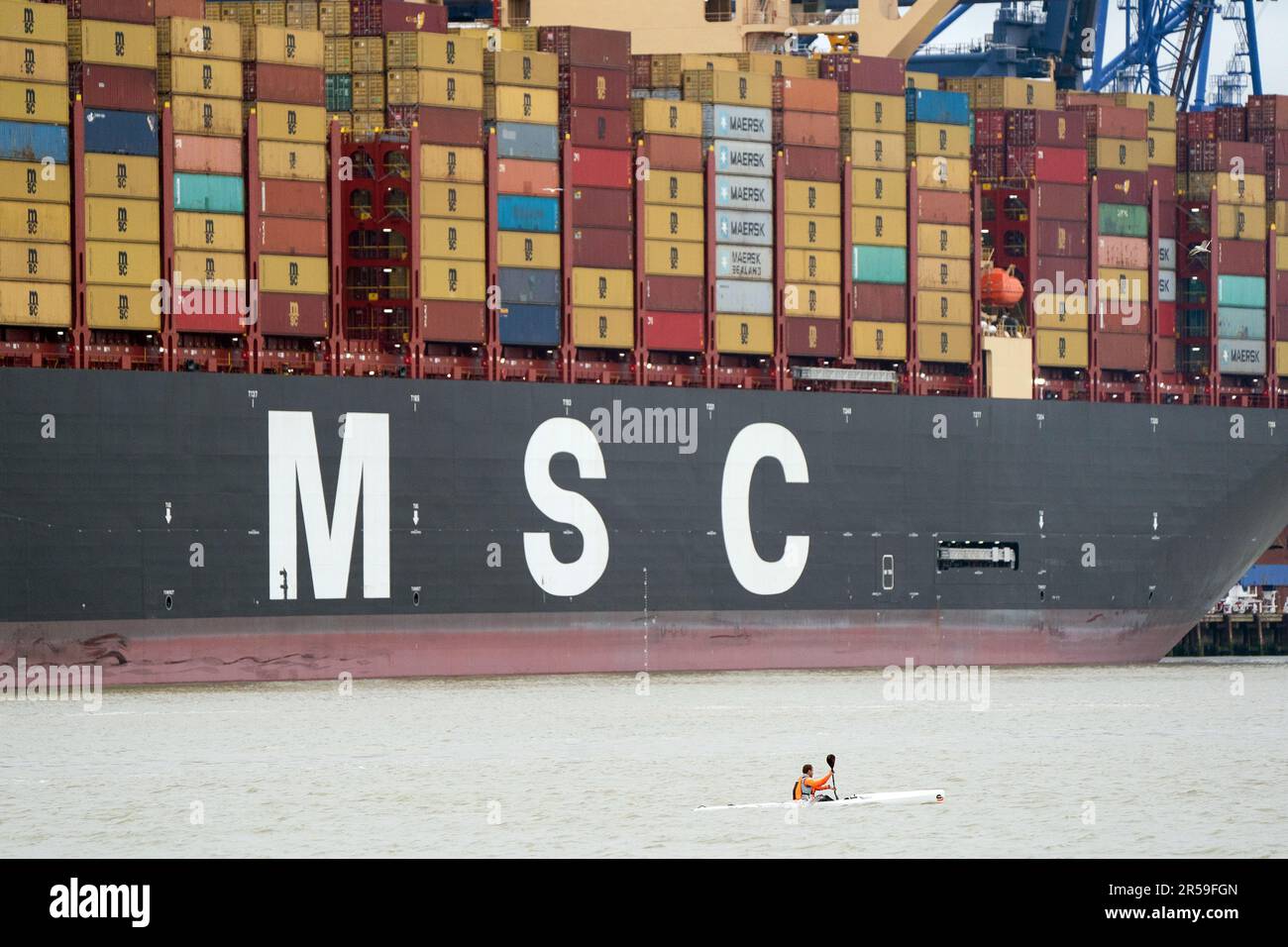 A man in a kayak is dwarfed by the world???s largest cargo ship, MSC ...