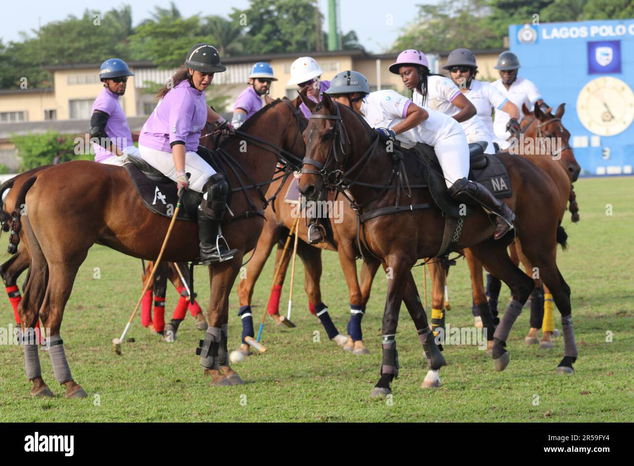 Polo players compete for the ball during the Ladies Polo invitation ...