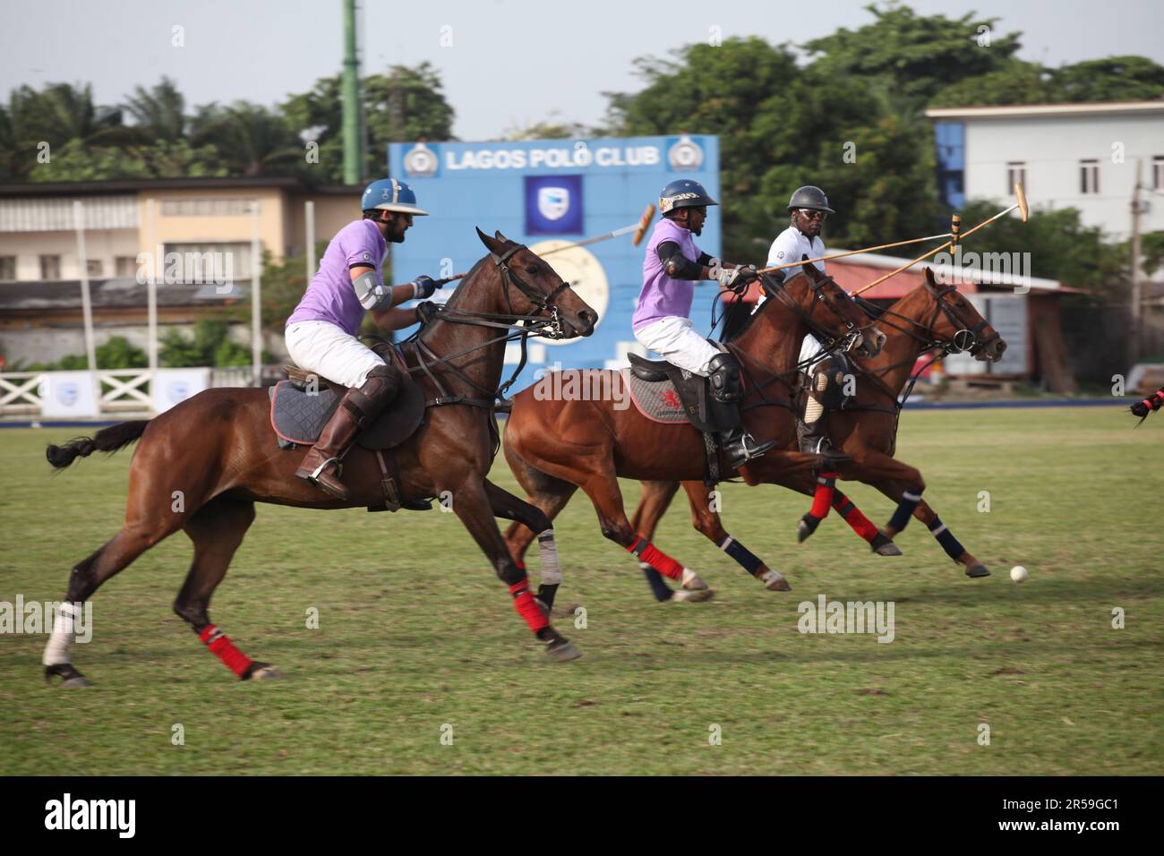 Polo players compete for the ball during the Ladies Polo invitation ...