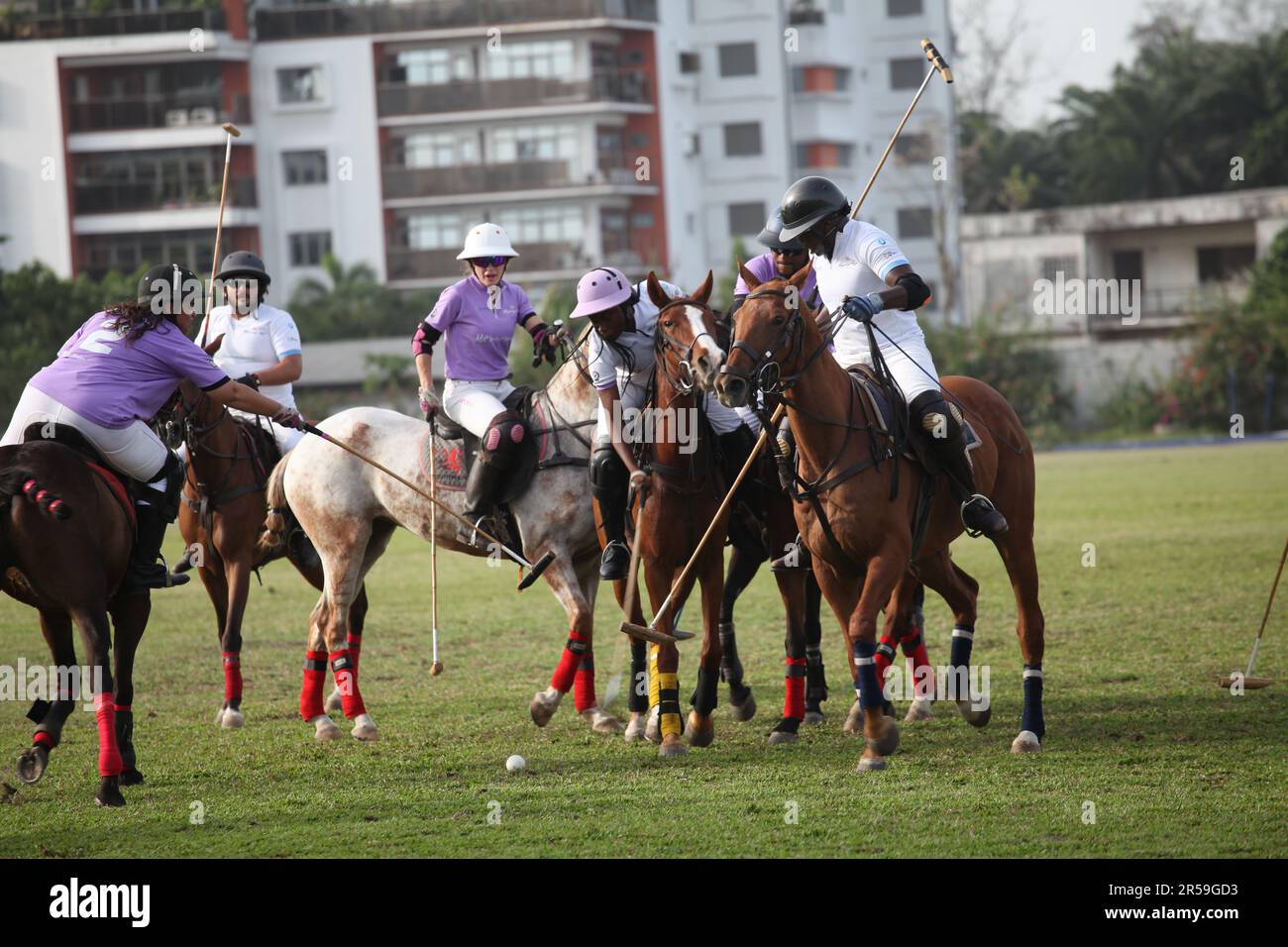 Polo players compete for the ball during the Ladies Polo invitation ...