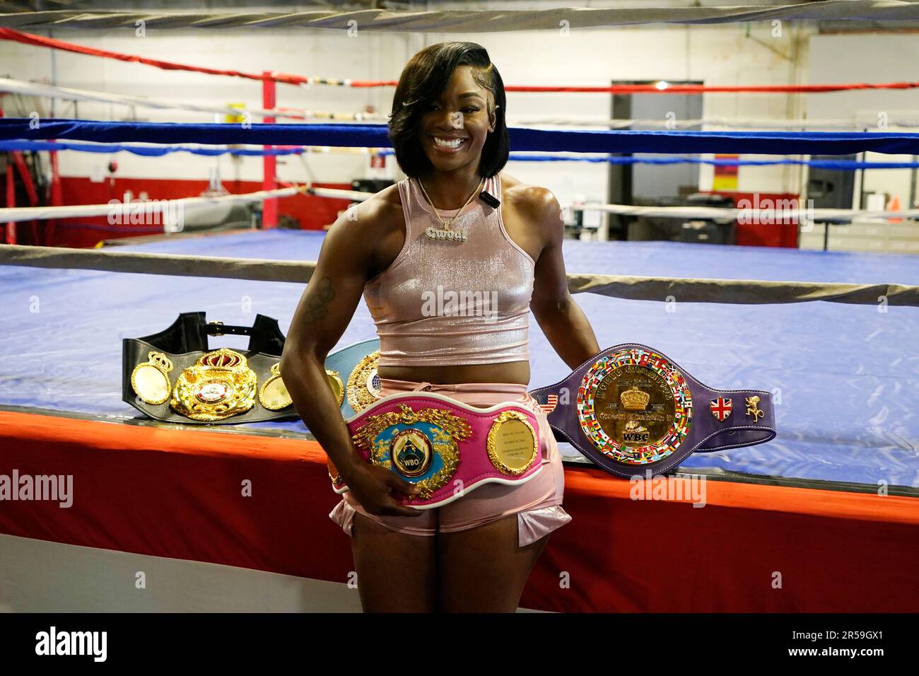 Claressa Shields poses with her prize belts after an interview, Tuesday ...