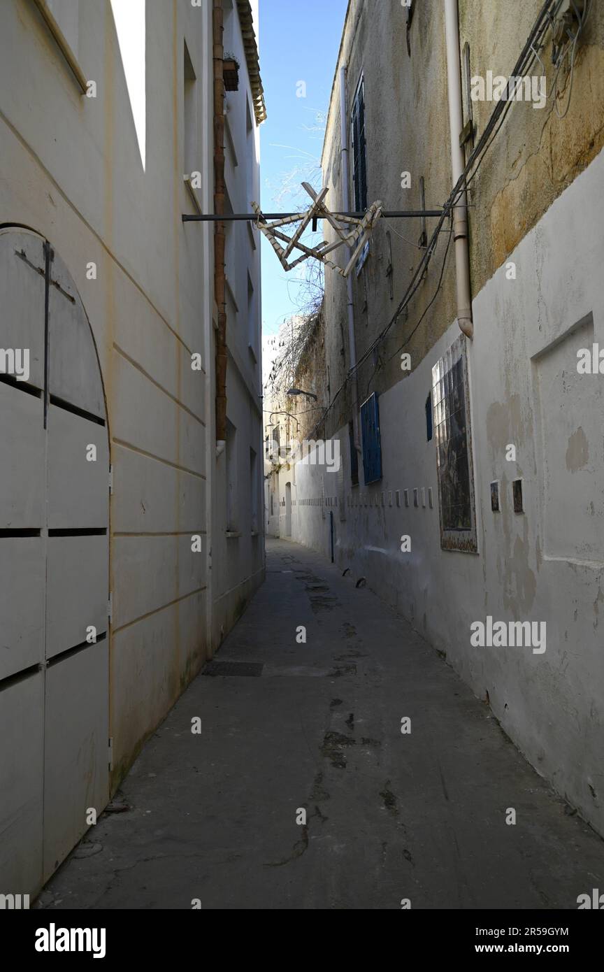 Typical narrow street with traditional Mazara houses at the so-called ...
