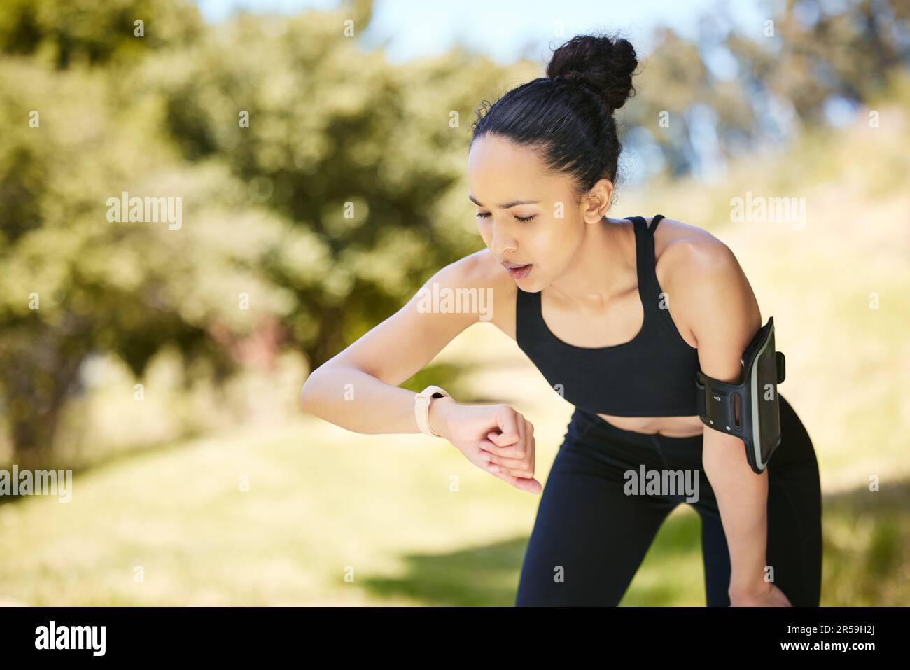 Woman, fitness and checking watch in rest after running, cardio ...