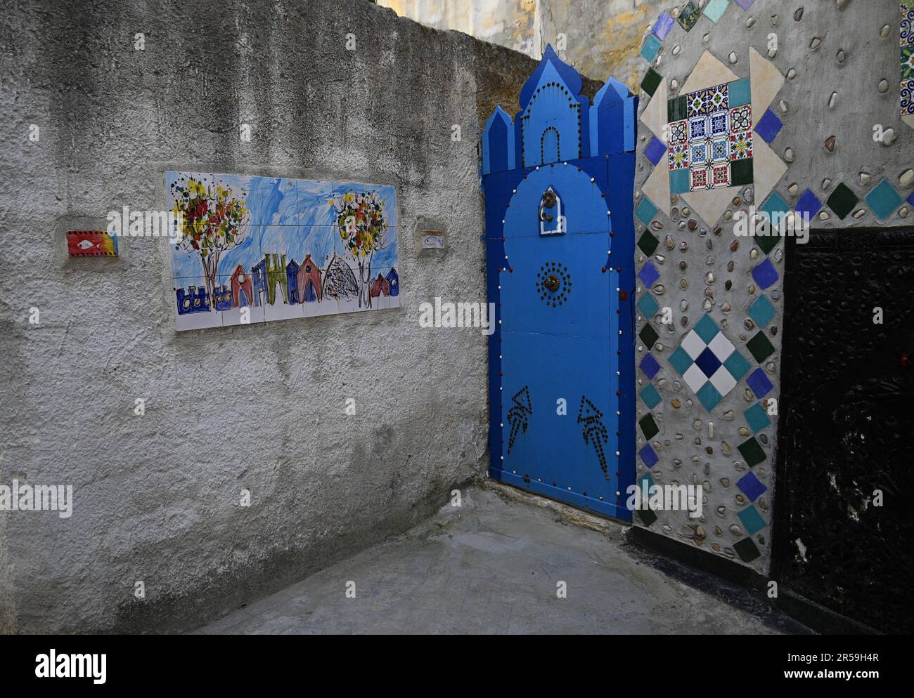 Typical house on Via Pilazza with a striking blue entrance door at the ...