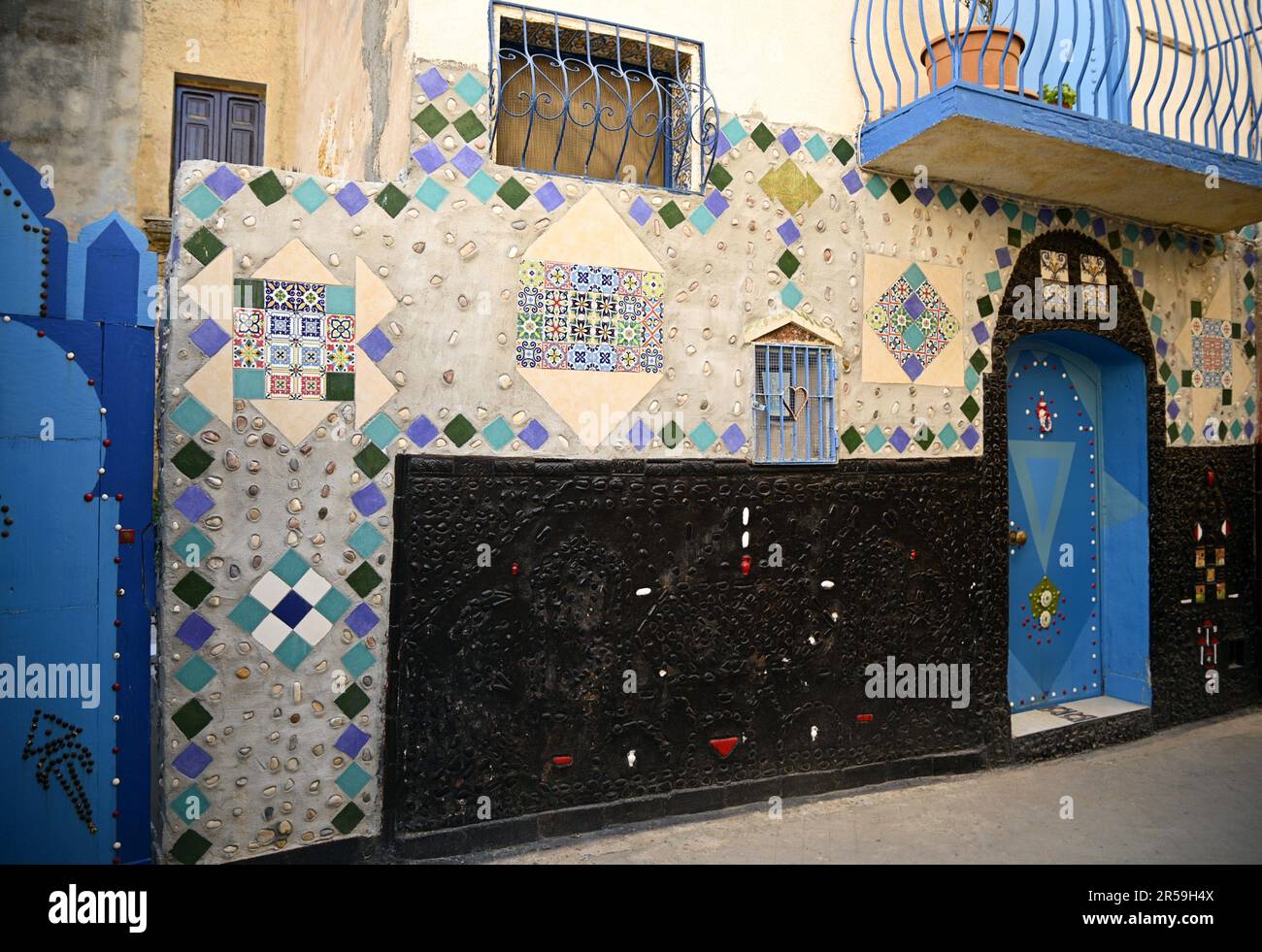 Typical house on Via Pilazza with a striking blue entrance door at the ...