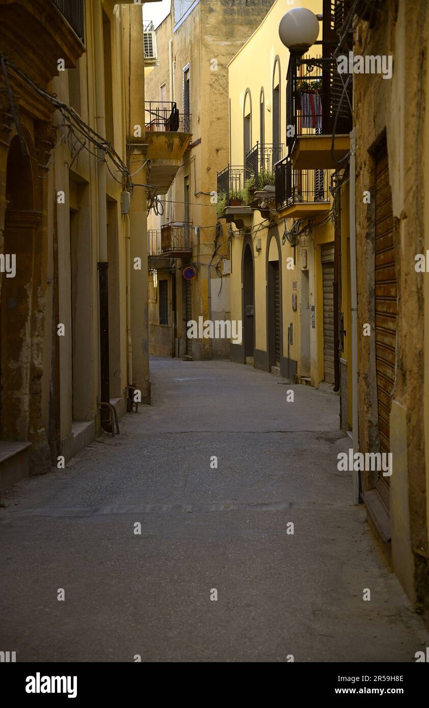 Typical narrow street with traditional Mazara houses at the so-called ...
