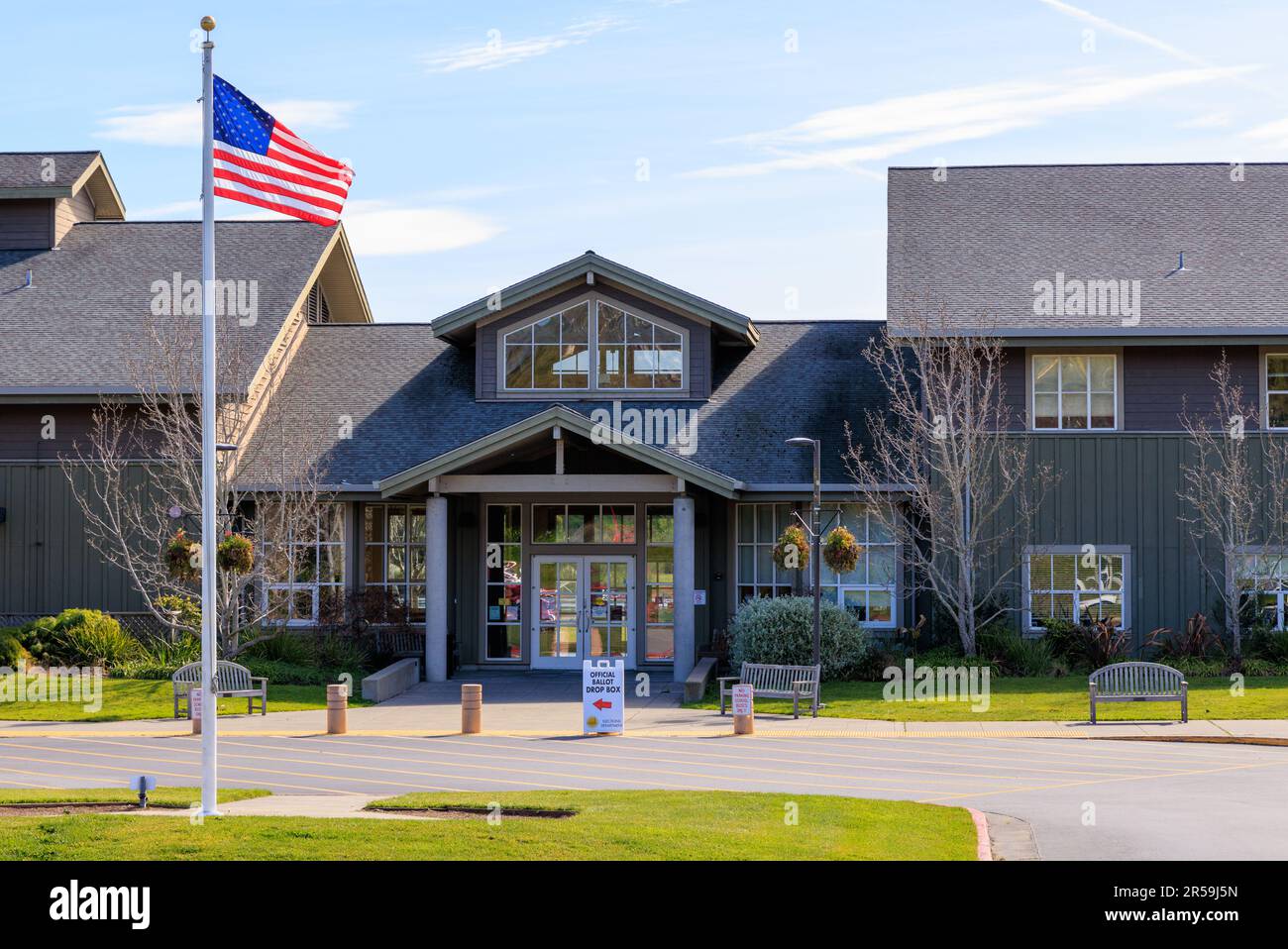 American flag flies over local government building on voting day Stock ...