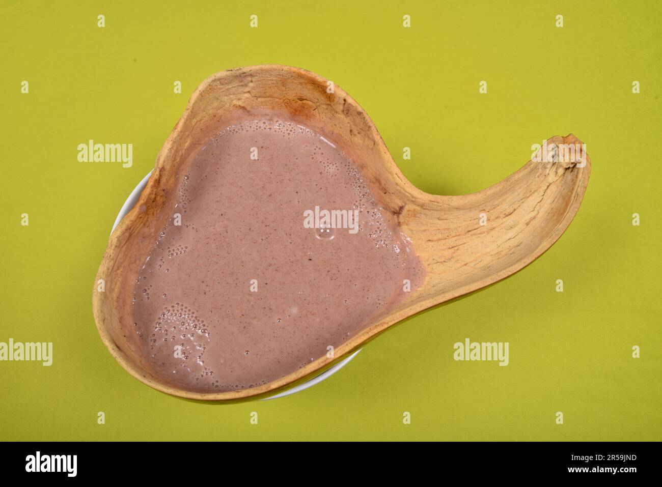 Kenyan sorghum porridge in a gourd soppon on green background Stock ...