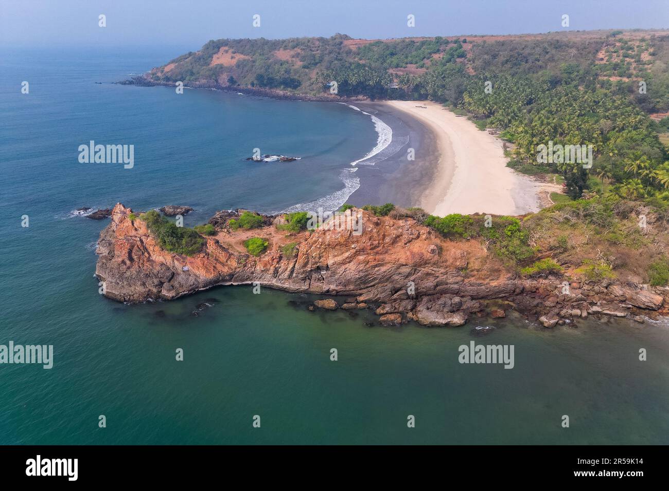 Aerial top view on tropical beach with green palm trees under sunlight ...