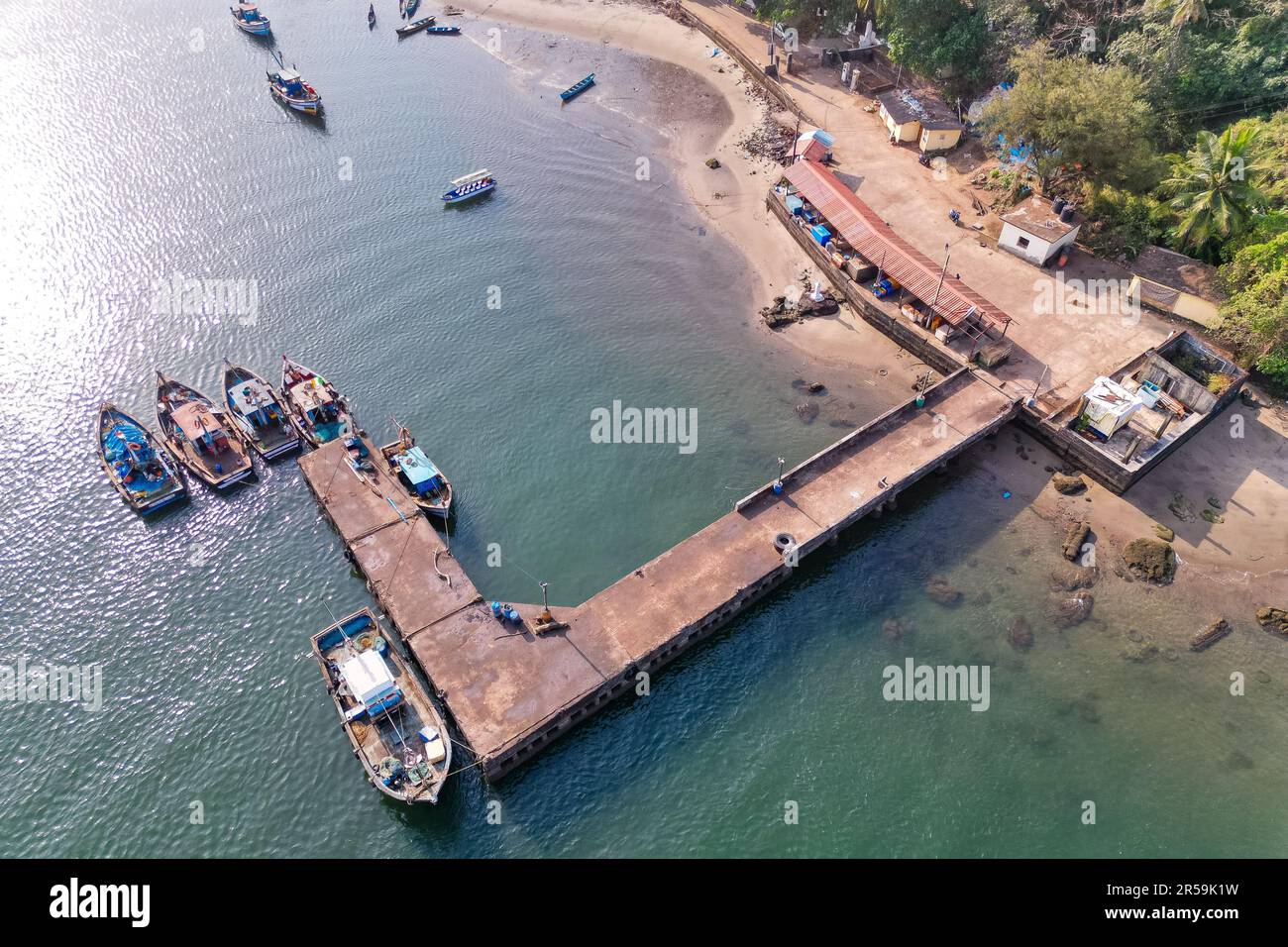Aerial top view on tropical beach with green palm trees under sunlight ...