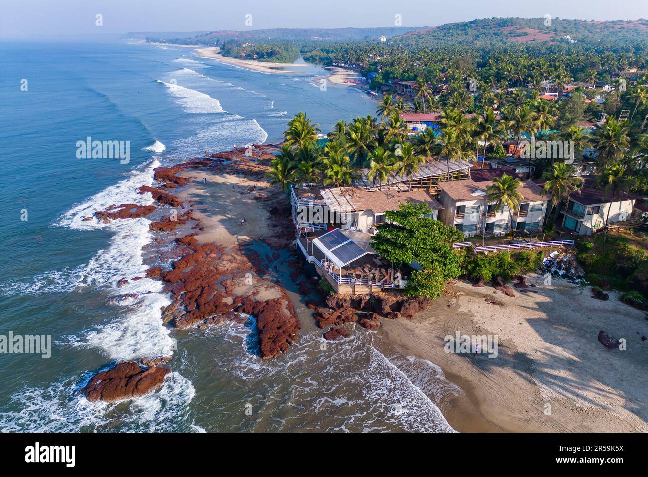 Aerial top view on tropical beach with green palm trees under sunlight ...