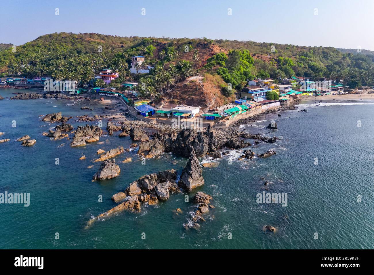 Aerial top view on tropical beach with green palm trees under sunlight ...