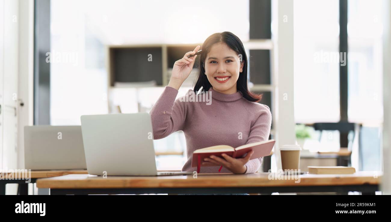 Young student studying in classroom at college. Student working at ...