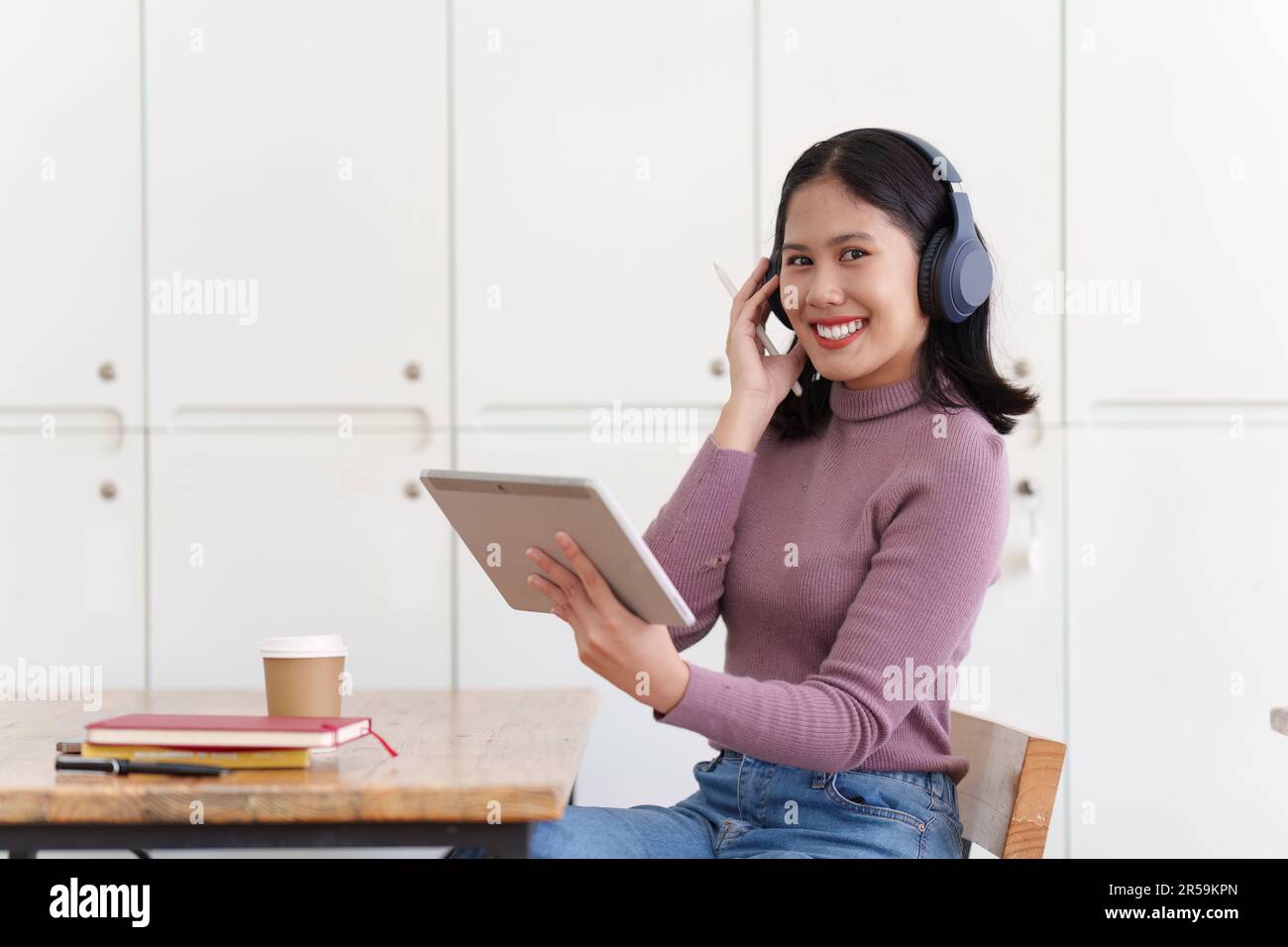 Young student studying in classroom at college. Student working at ...