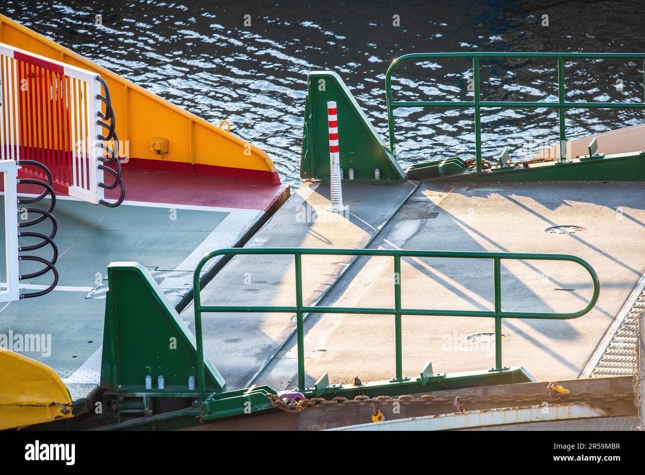 Ramp of a yellow car ferry lowered and ready for loading cars Stock ...