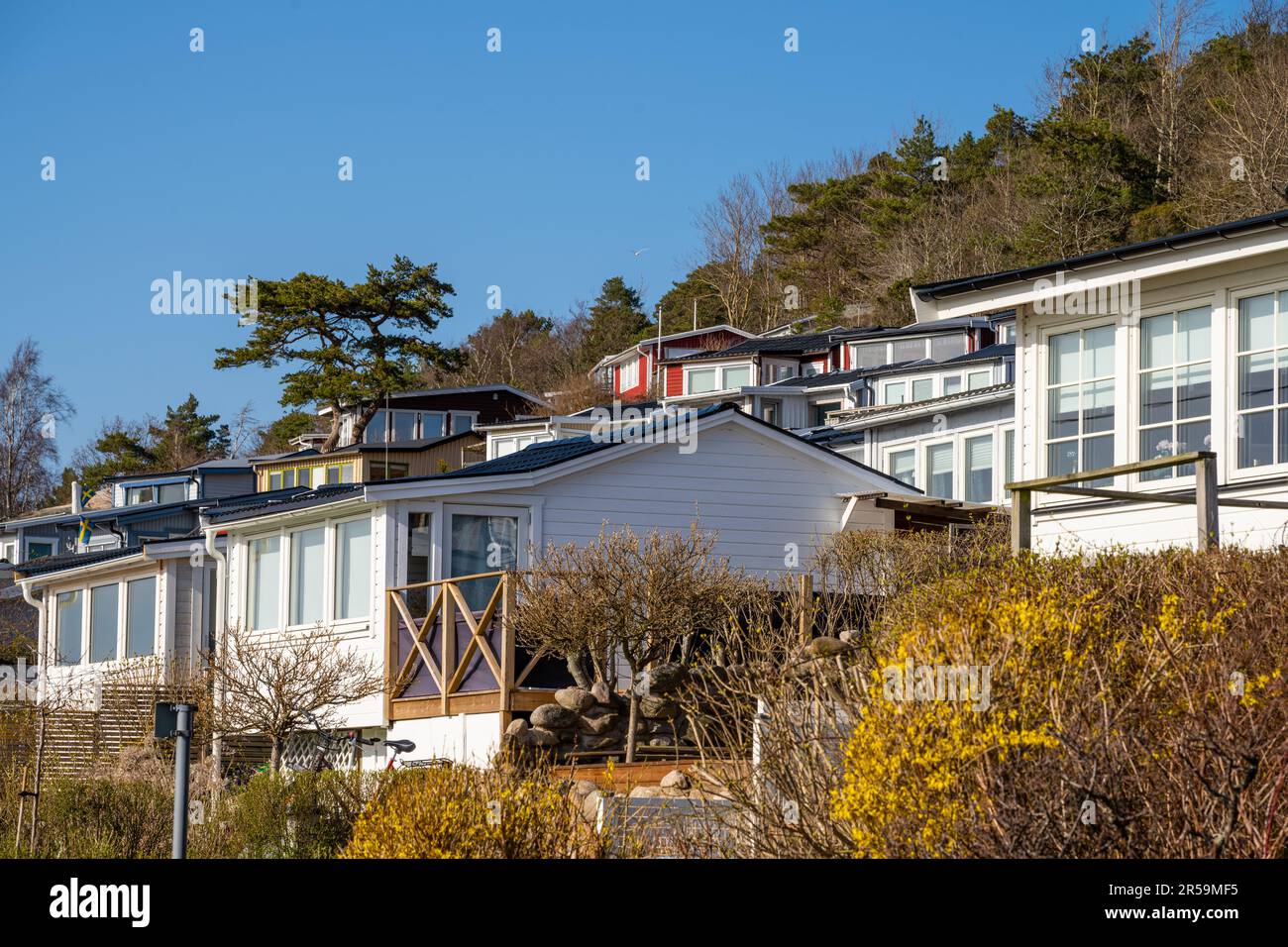 Small summer houses in tight formation Stock Photo - Alamy