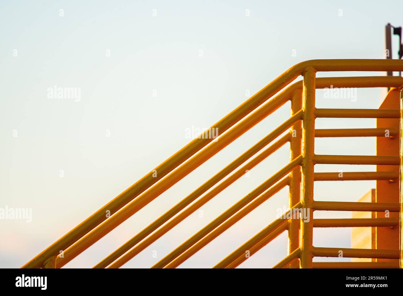Yellow metal hand railings on a ferry Stock Photo - Alamy