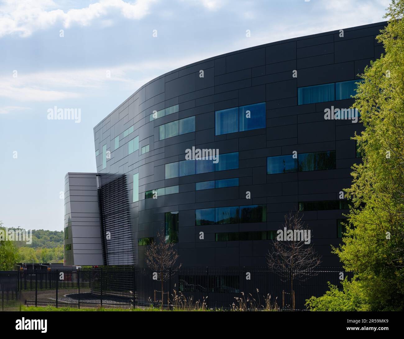 Large dark office building with odd angles Stock Photo - Alamy