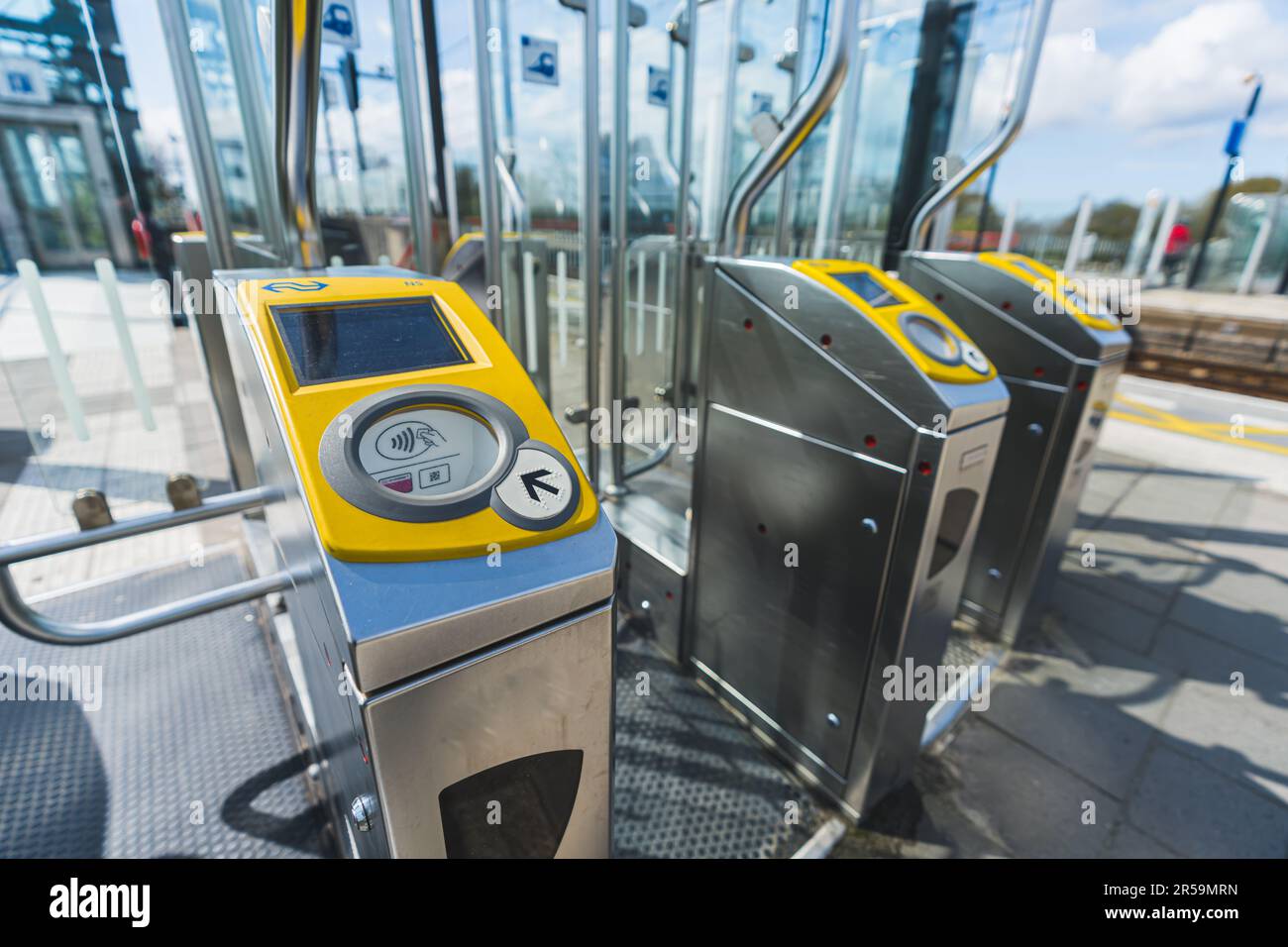 Outdoor entrance to the railway station through stainless-steel yellow ...
