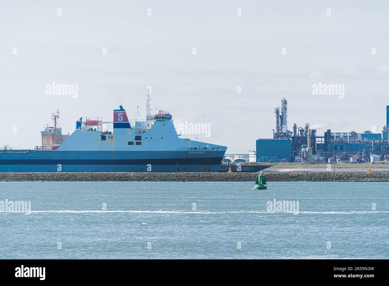 Massive ship docking at Maasvlakte Rotterdam. Cloudy weather, calm sea ...