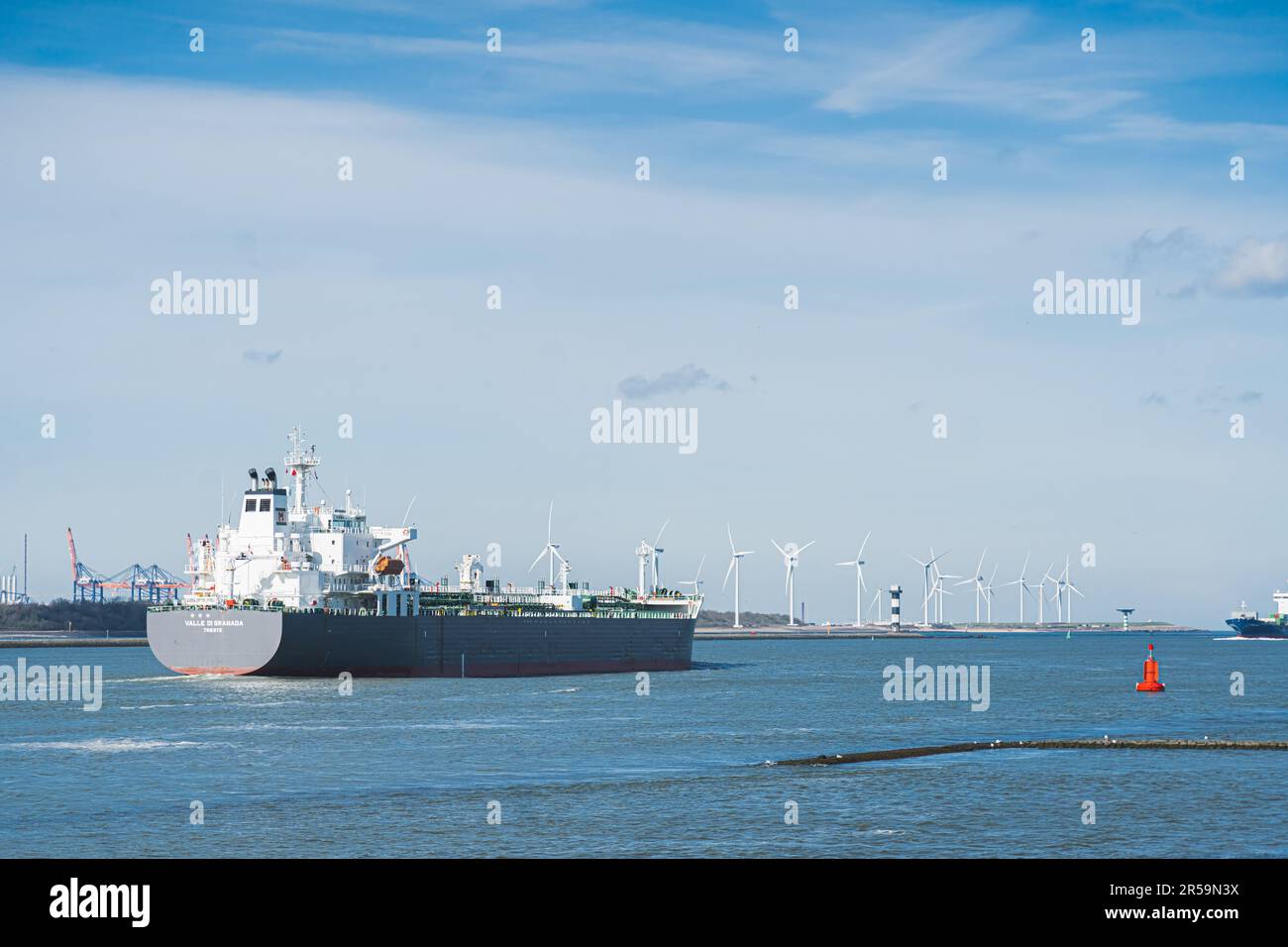 Massive ship sailing out of the largest seaport in Europe - Maasvlakte ...