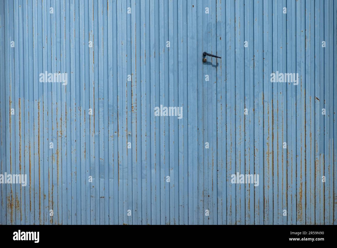 old blue painted corrugated metal door Stock Photo - Alamy