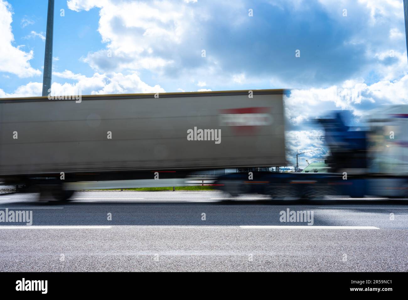 Truck and trailer passing at high speed Stock Photo - Alamy