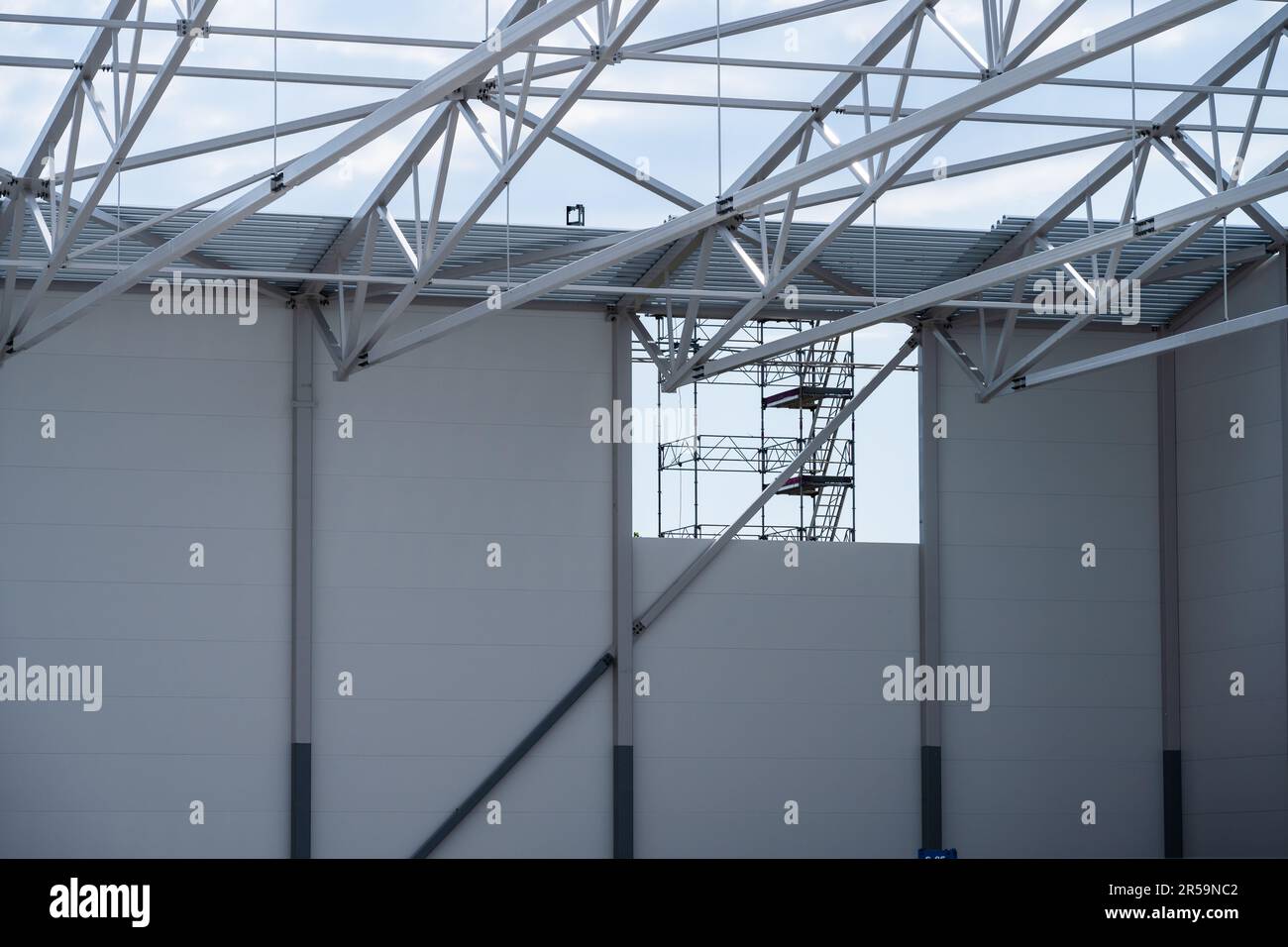 White painted steel beams and girders of a warehouse under construction ...