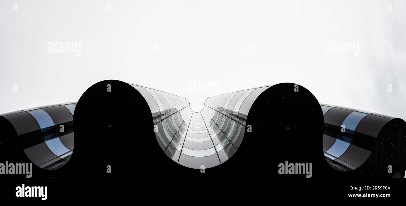 Wave formed glass facade of an office building Stock Photo - Alamy