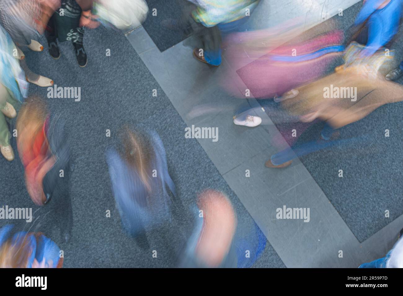 People moving around the floor of a book fair Stock Photo - Alamy