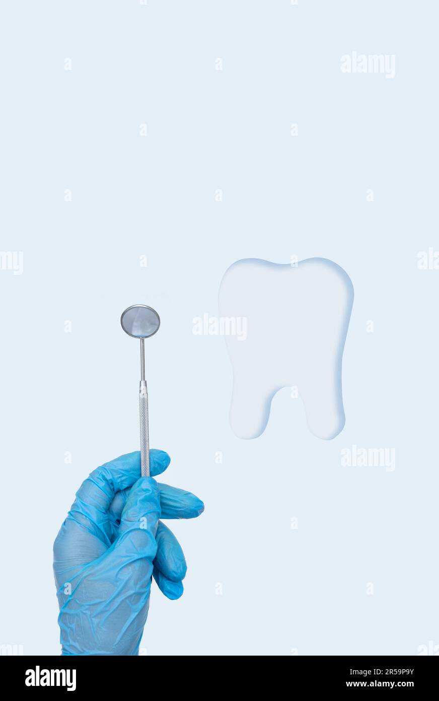 Different tools for dental care in woman hand with paper cut shape ...