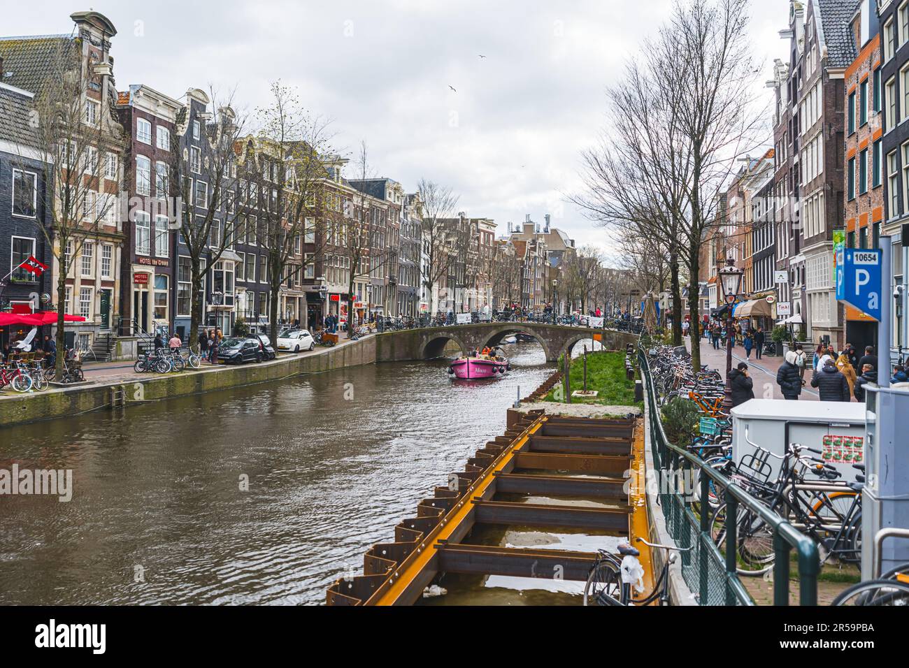 Amsterdam canal in the downtown, Holland. Cloudy weather over the ...