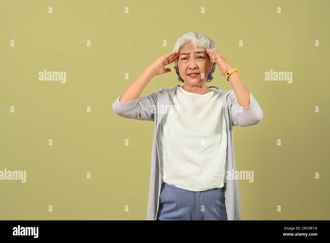 Sick mature woman touching sore head suffering from headache, migraine ...