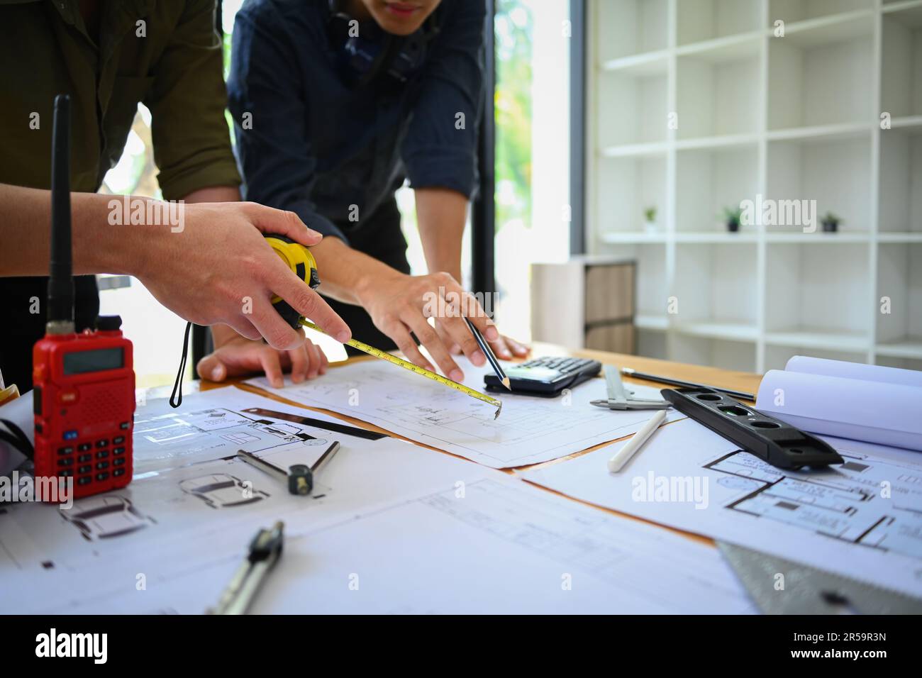 People coworking on construction project hi-res stock photography and ...